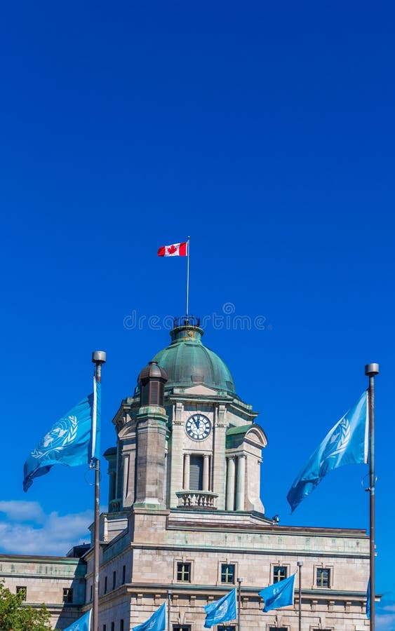 Flags at Old Quebec City Building Editorial Image - Image of flag ...