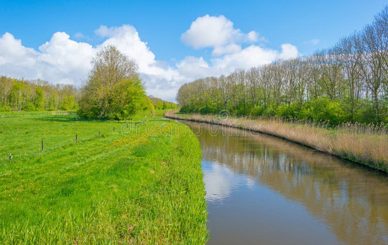 Canal through the Countryside in Spring Stock Photo - Image of water ...