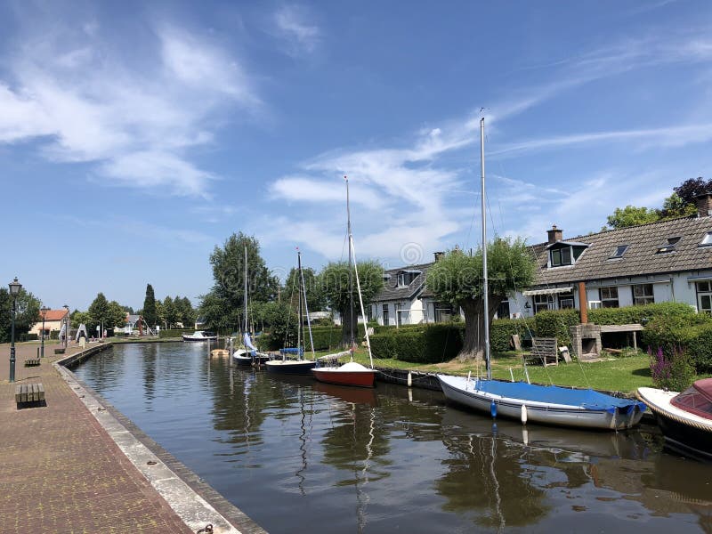 Canal in Langweer editorial stock image. Image of housing - 186267484