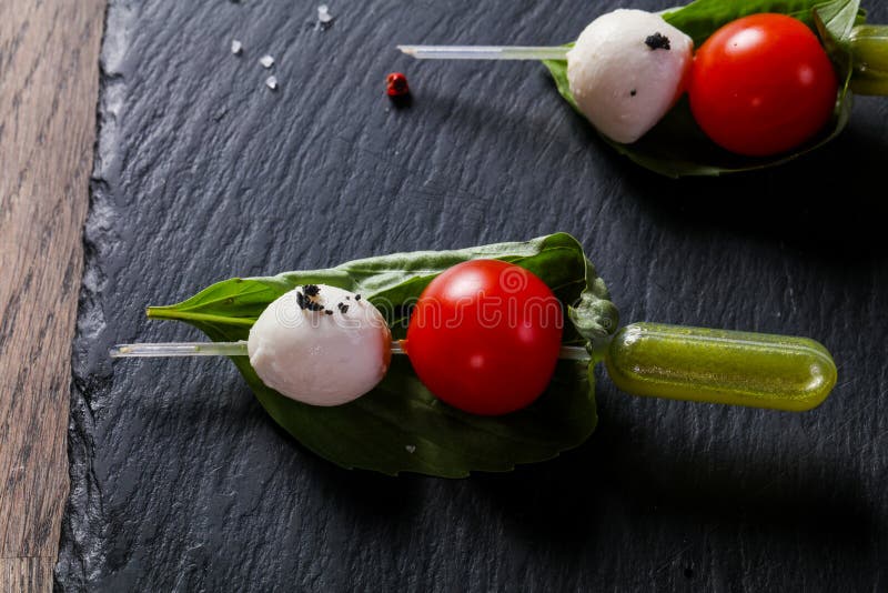 Canape caprese with oil stock image. Image of appetizer - 121330497