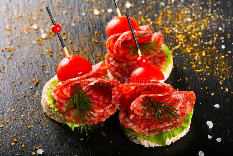 Canape with salami stock image. Image of holiday, black - 112080435