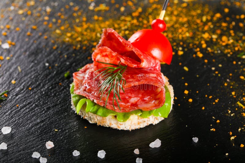 Canape with salami stock photo. Image of green, lunch - 124999020