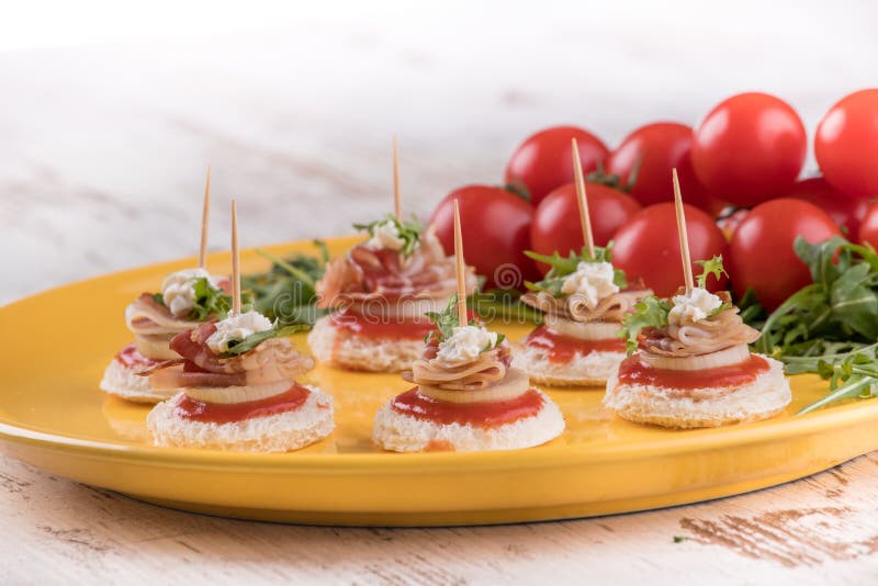 Canapes with bacon stock photo. Image of banquet, canapes - 113175656
