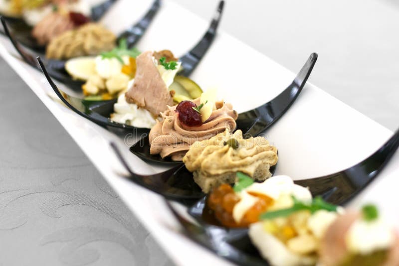 Canapes on Black Plastic Spoons Stock Photo - Image of party ...