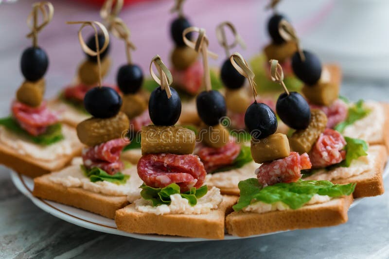 Canapes with Ham, Cheese, Cucumber and Olives. Festive Buffet Stock ...