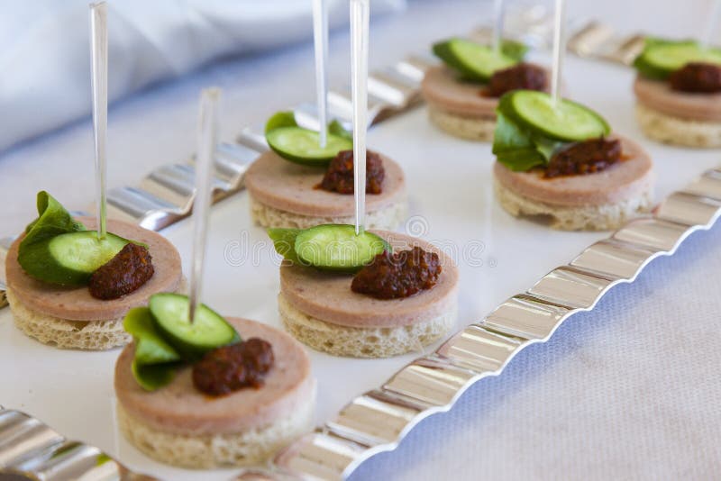 Canapes with Lettuce Sausage and Tomato Stock Photo - Image of dish ...