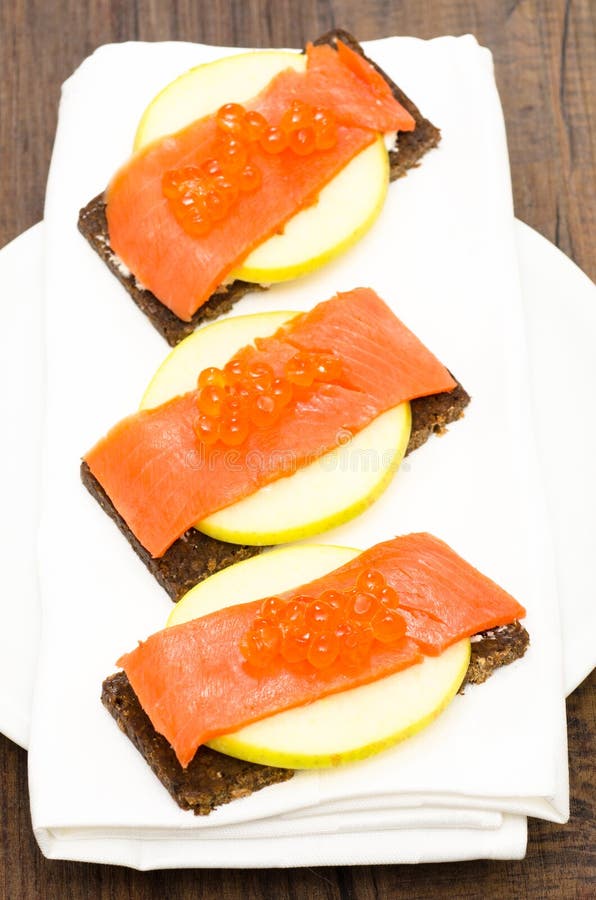 Canapes with Salmon, Caviar and Apple Stock Photo - Image of sandwich ...