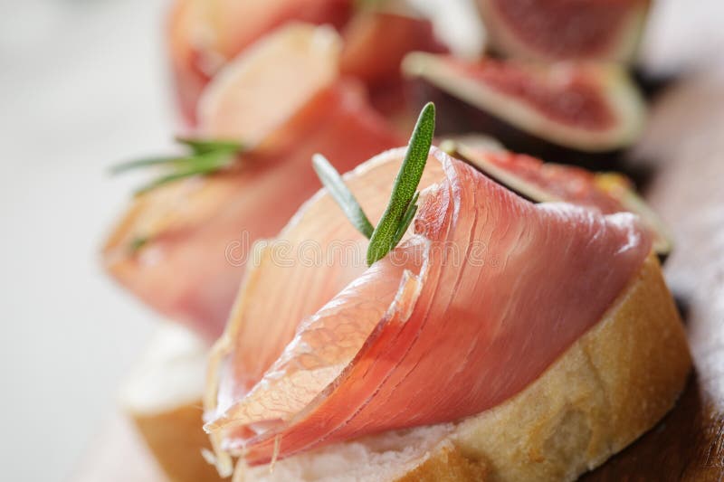 Canapes with spanish jamon stock image. Image of rosemary - 40718635