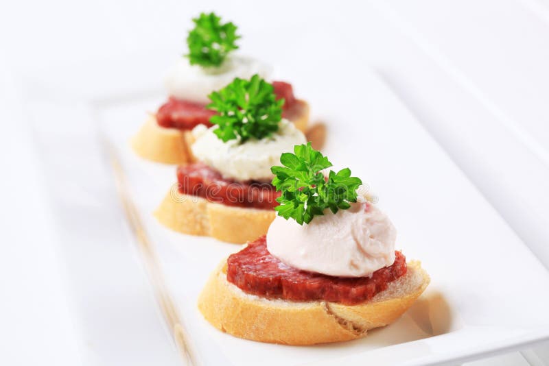 Canapes stock photo. Image of salami, spread, appetizer - 55695758