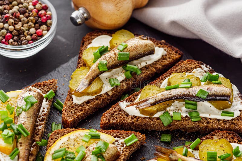 Canapes with Sprats on a Black Stone Tray Stock Image - Image of open ...