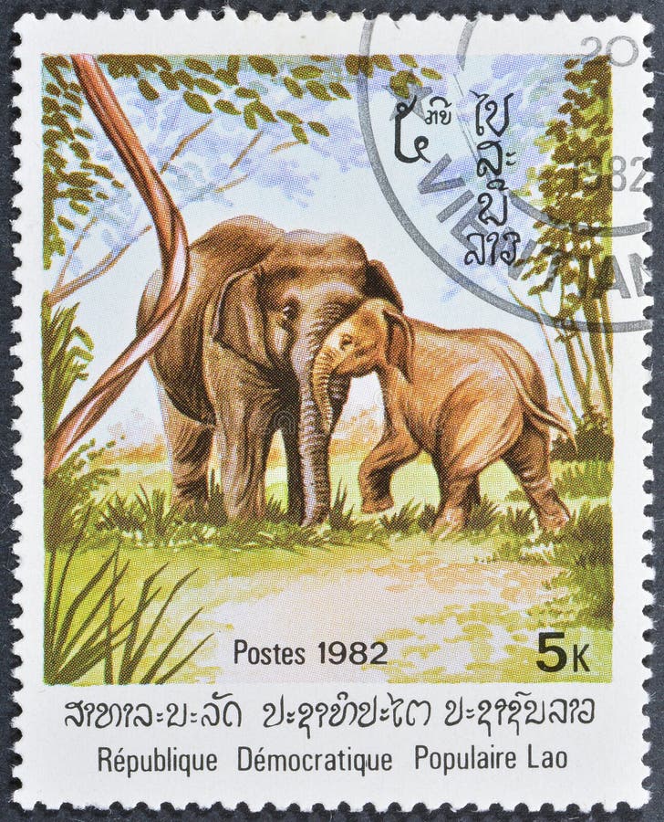 Cancelled Postage Stamp Printed by Laos, that Shows Asian Elephant ...