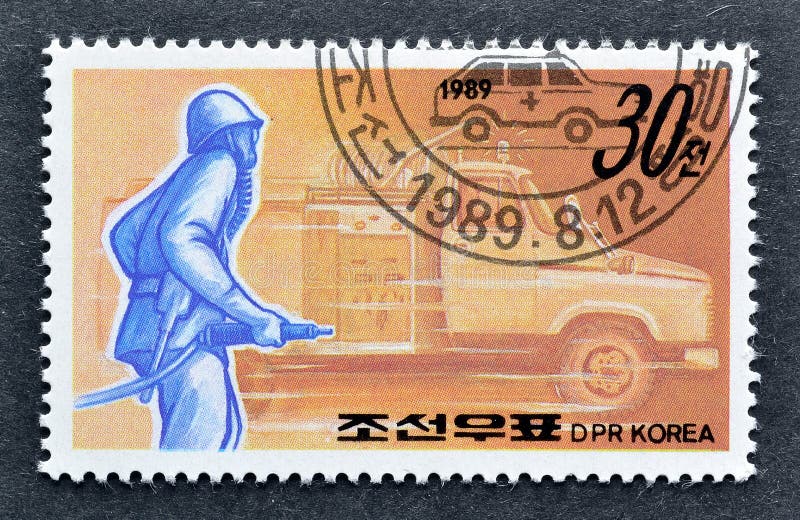 Cancelled Postage Stamp Printed by North Korea, that Shows Fireman and ...