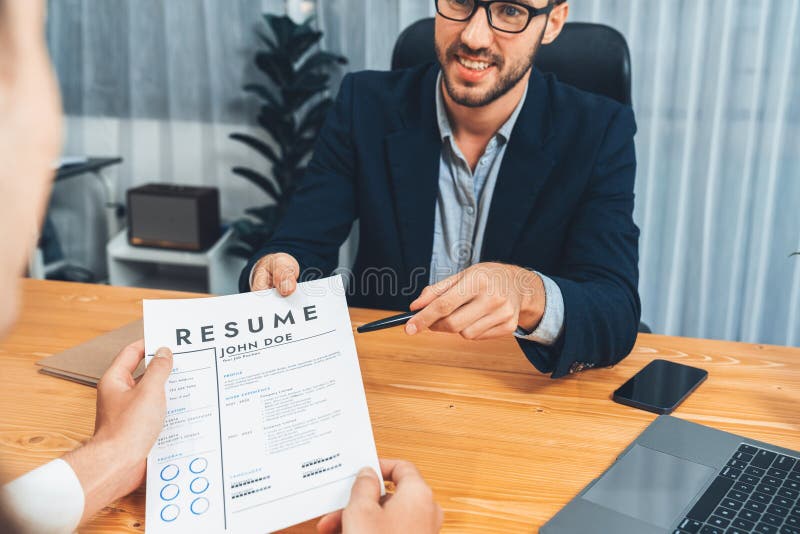 Candidate Handing Resume or CV Over Table To Interviewer. Entity Stock ...