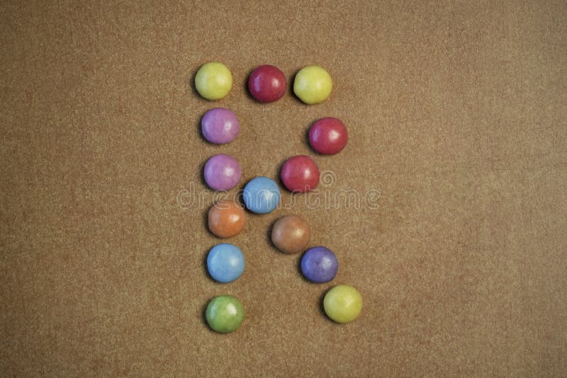 Candies forming letter R stock photo. Image of slice - 88502090