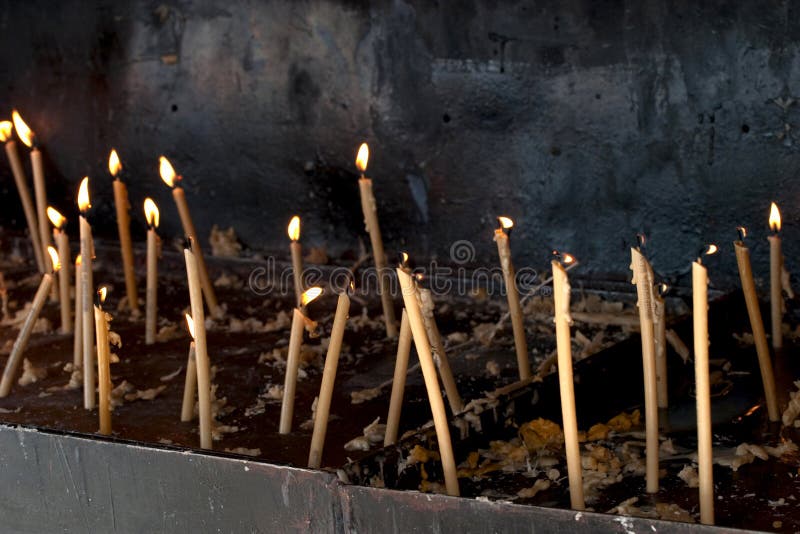 Some Ignited Candles in a Support Stock Image - Image of burning ...