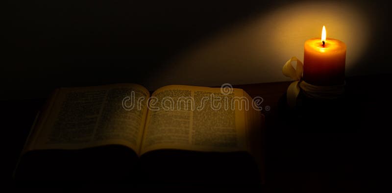 Reading over candle light stock image. Image of fire - 173207503