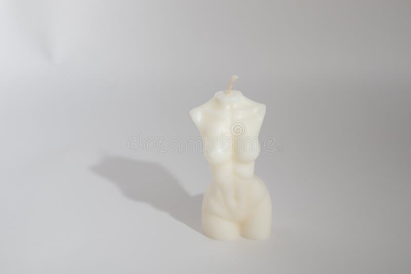 Candle Figure of a Human Torso on a White Background with a Shadow ...