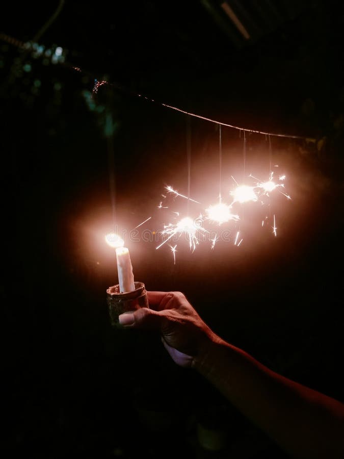 A Candle with fireworks stock image. Image of font, poster - 254322175