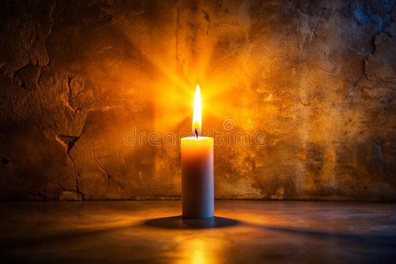 A Candle Flame Burning Brightly in a Dark Room, Casting a Warm Glow and ...