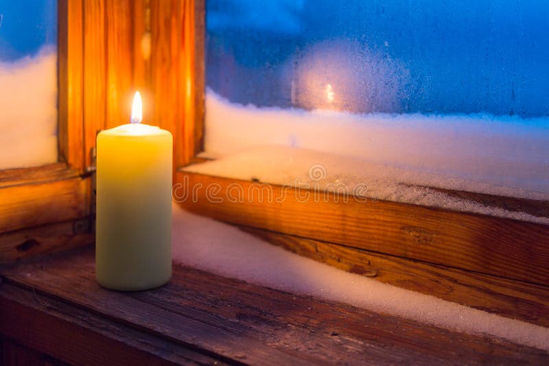 Candle on frozen window stock image. Image of background - 83750085