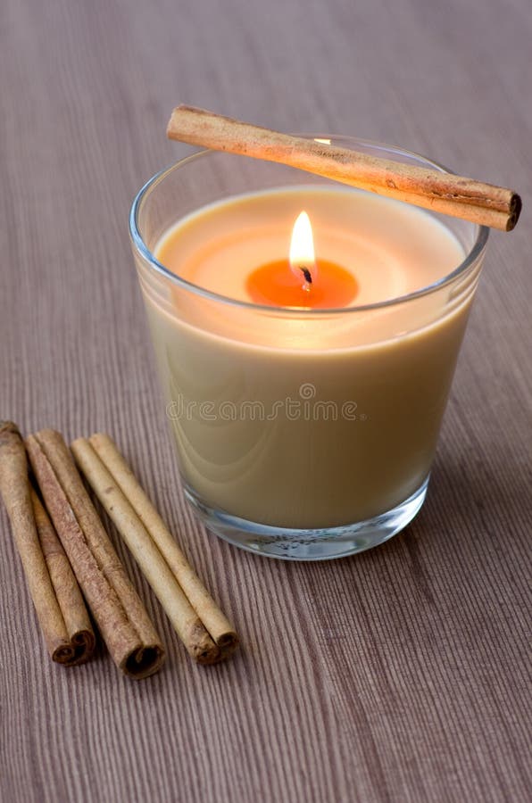Candle in the Glass and Cinnamon Stock Photo - Image of stick, bright ...