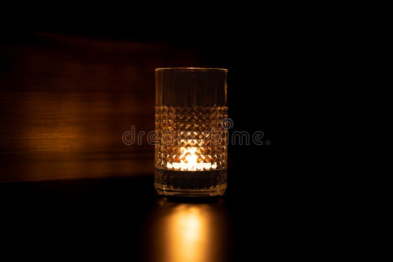 Candle in a Glass. Rays of Light are Refracted through the Walls of the ...