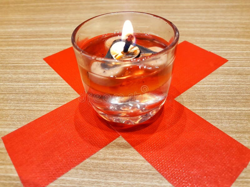 Candle on the Glass with Red Cross Stock Photo - Image of candle, cross ...