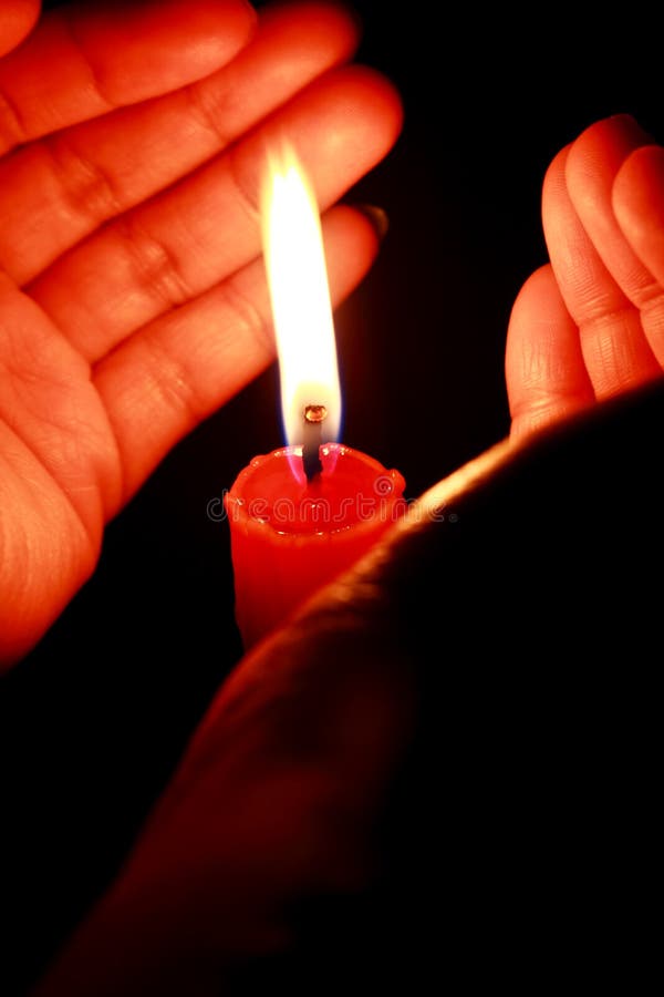 Candle between the hands stock photo. Image of burning - 17987576