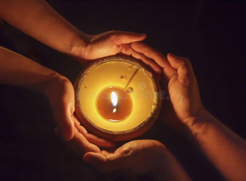 Candle in hands stock image. Image of light, contemplation - 10310297