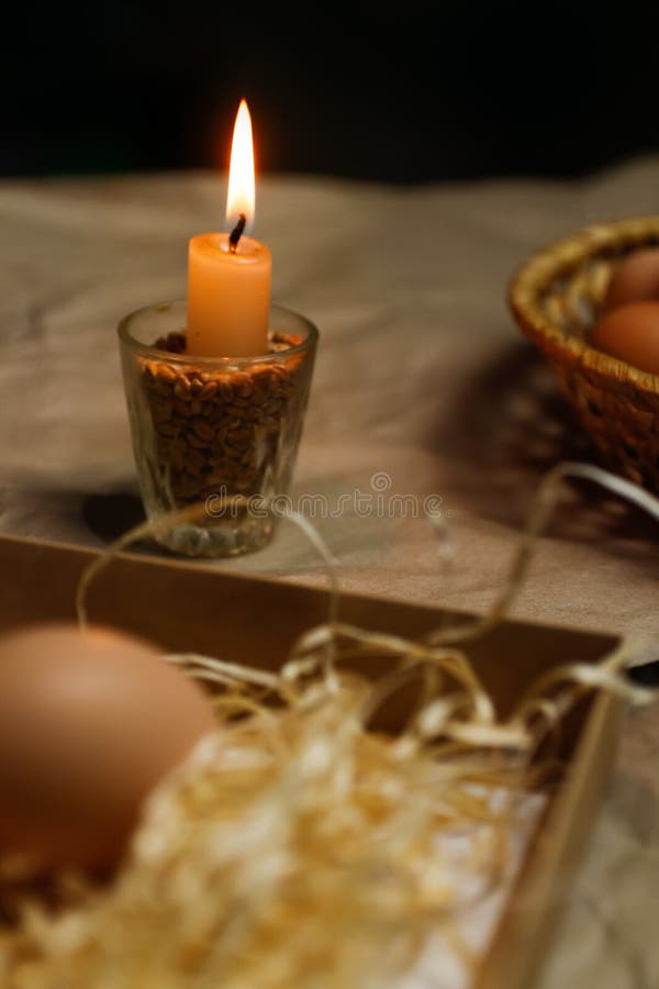 Candle with Light. Rustic Background. Tools for Decorating Paschal Eggs ...