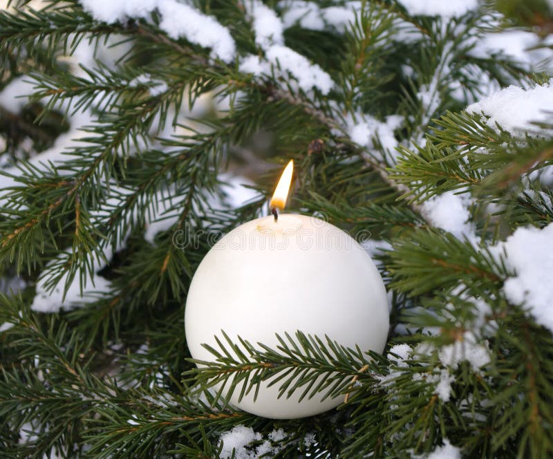 Candle Light on Snow-bound Firry Branches Stock Photo - Image of candle ...