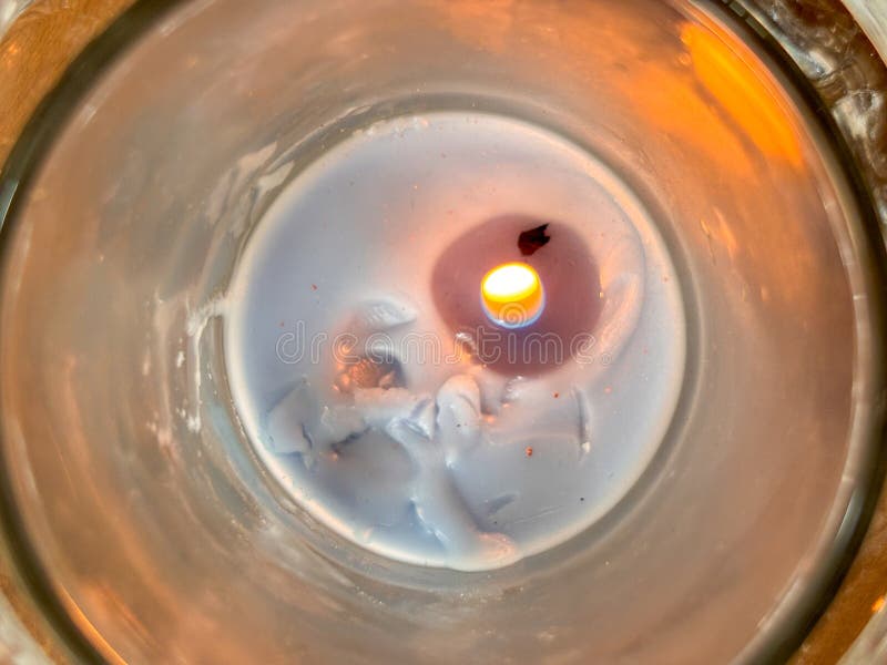 A Candle is Lit in a Glass Jar Stock Photo - Image of modern, surface ...
