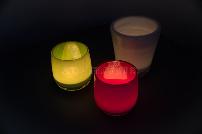 The Candlelight from Three Lanterns in Red, Green and White Glow in the ...