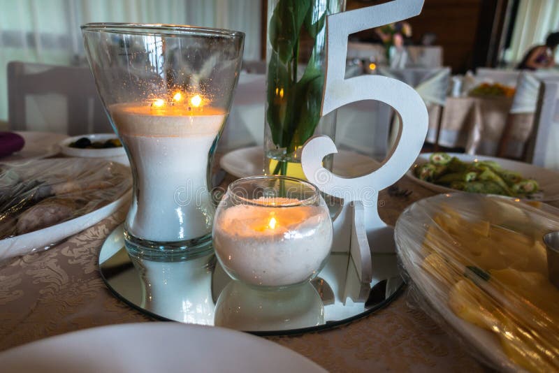 Candles in a Glass on a Table Stock Image - Image of five, decorative ...