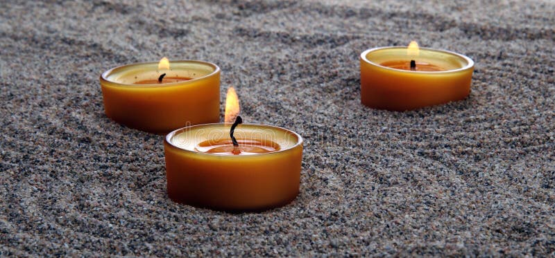 Candles in the Sand. Calming Patterns on the Sand Stock Image - Image ...