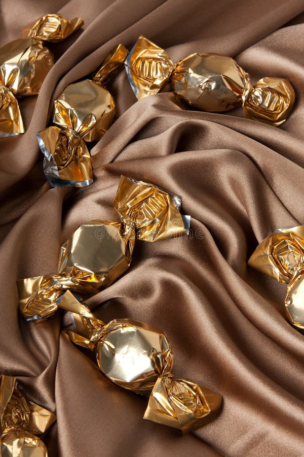Chocolate Candy in Golden Wrapper Stock Photo - Image of food, present ...