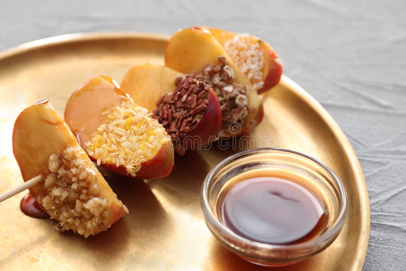 Candy Apple Wedges and Caramel in Bowl on Metal Tray Stock Image ...