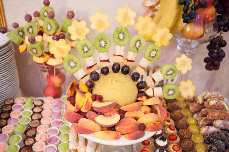Candy Bar.Different Delicious Fruits on Wedding Reception Table with ...