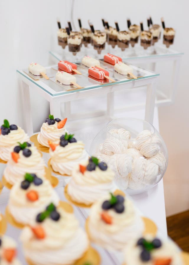 Table with Cakes and Desserts Stock Photo - Image of white, table ...