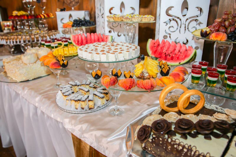 Candy Bar at the Wedding Reception. Cakes, Sweets and Fruit on the ...