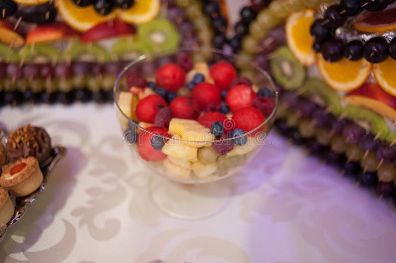 Candy Bar.Different Delicious Fruits on Wedding Reception Table with ...