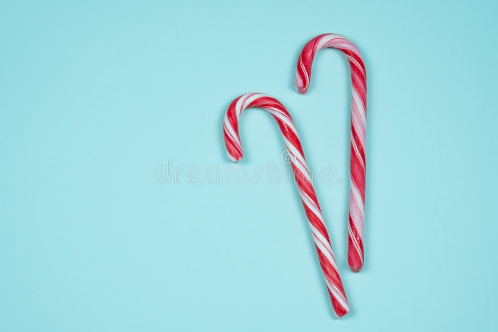 Candy Canes on a Light Blue Background Stock Image - Image of contrasts ...