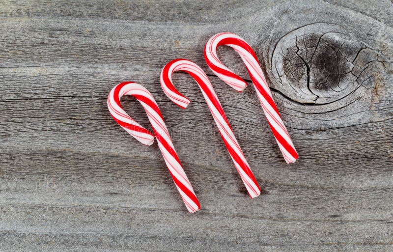 Candy Canes on Rustic wood stock photo. Image of christmas - 47673248
