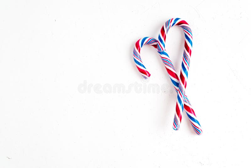 Candy Canes on a White Surface, Top View, Place for Text Stock Image ...