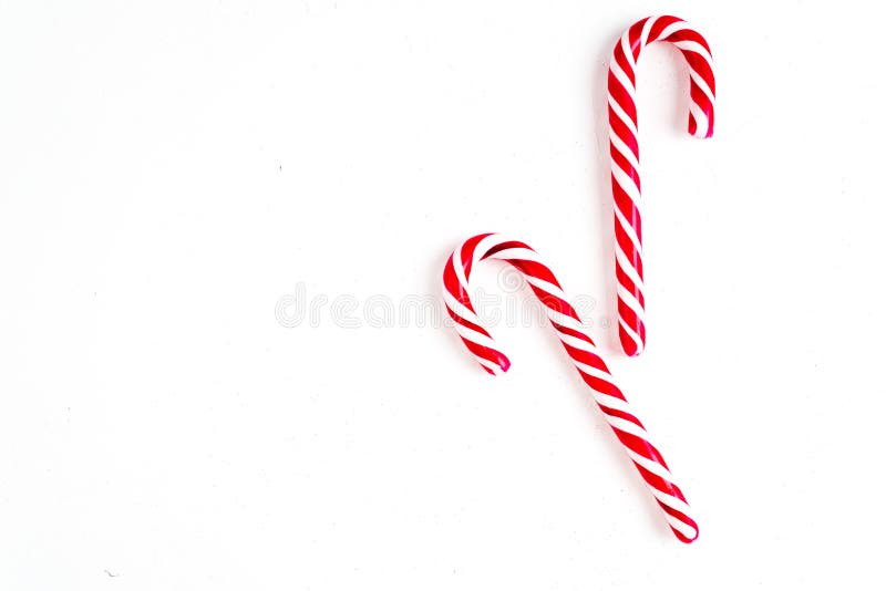 Candy Canes on a White Surface, Top View, Place for Text Stock Photo ...