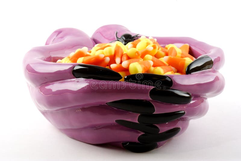 Candy corn in evil hands stock image. Image of black, bowl - 3107661