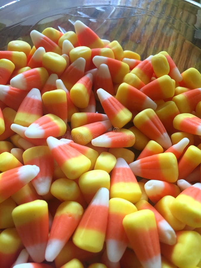 Candy corn in a glass bowl stock photo. Image of treat - 109229646