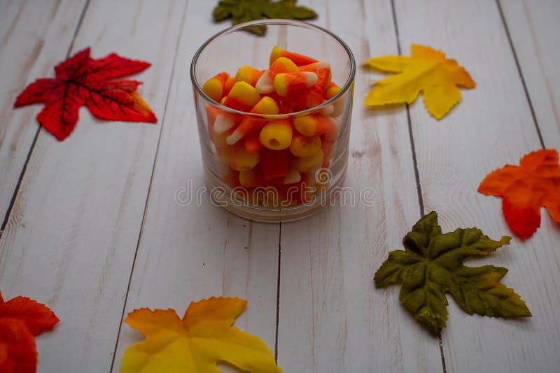 Candy Corn in a Mini Glass Surrounded by Leaves Stock Image - Image of ...