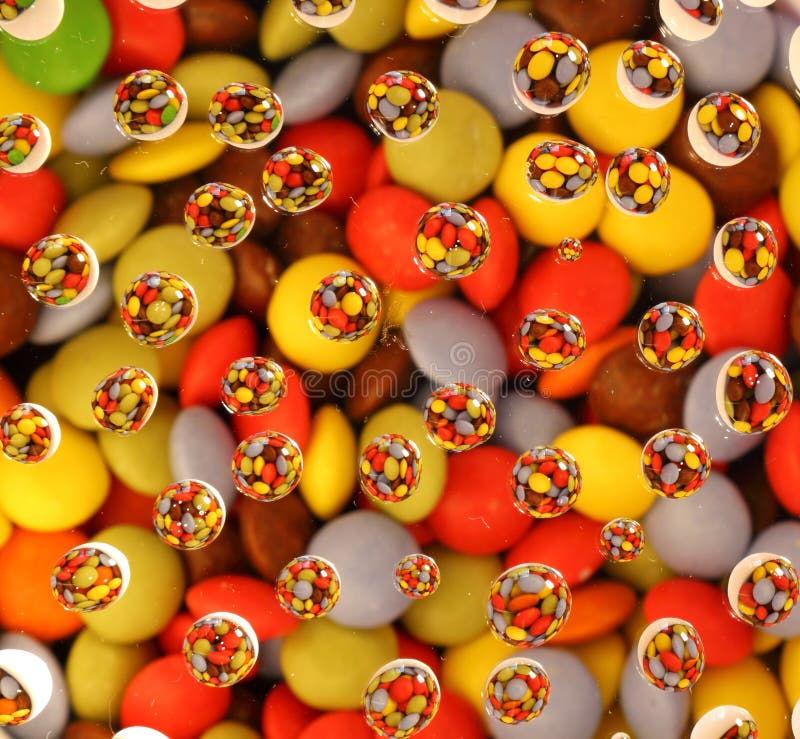 Candy between the drops stock image. Image of glossy - 79002485
