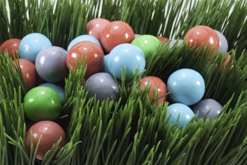 Candy gumballs in grass stock image. Image of collection - 23780067
